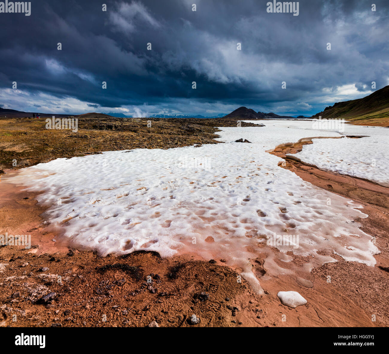 Summer snow in the Krafla volcano. Colorful exotic landscape with lava ...