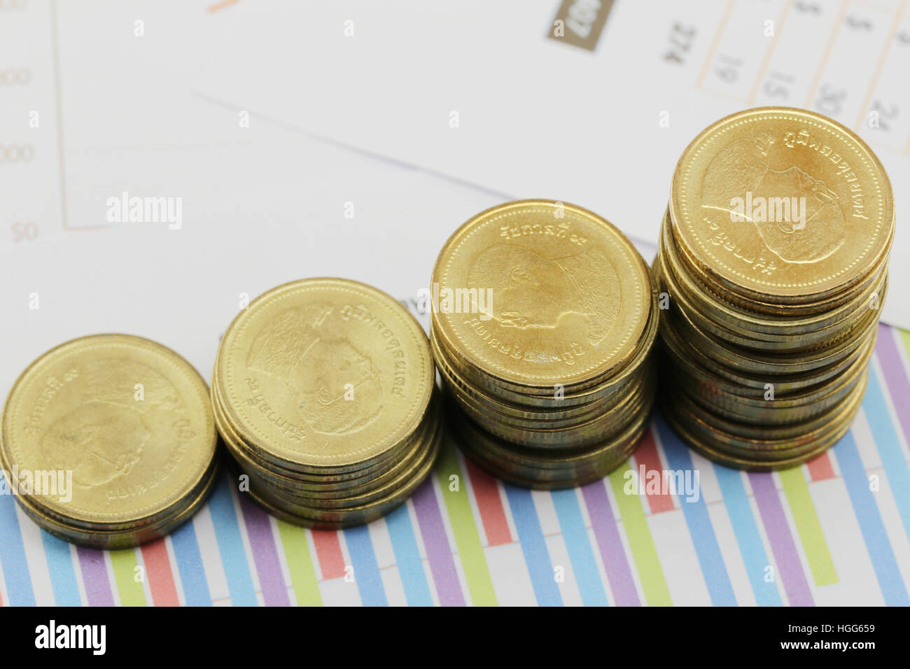 bar graph of Gold coins on paper business documents,concept of ...