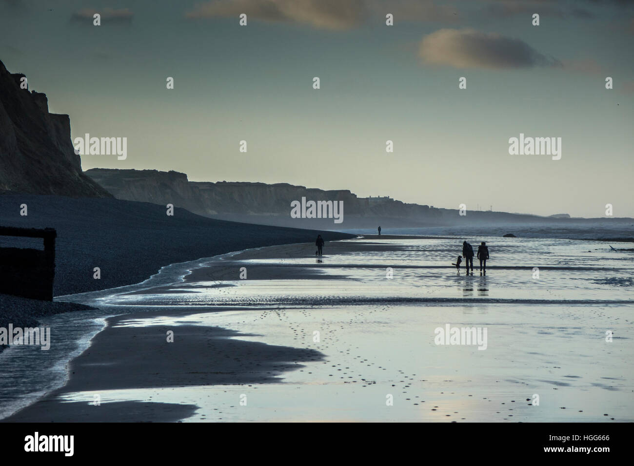 Sheringham beach and cliffs dusk Stock Photo - Alamy