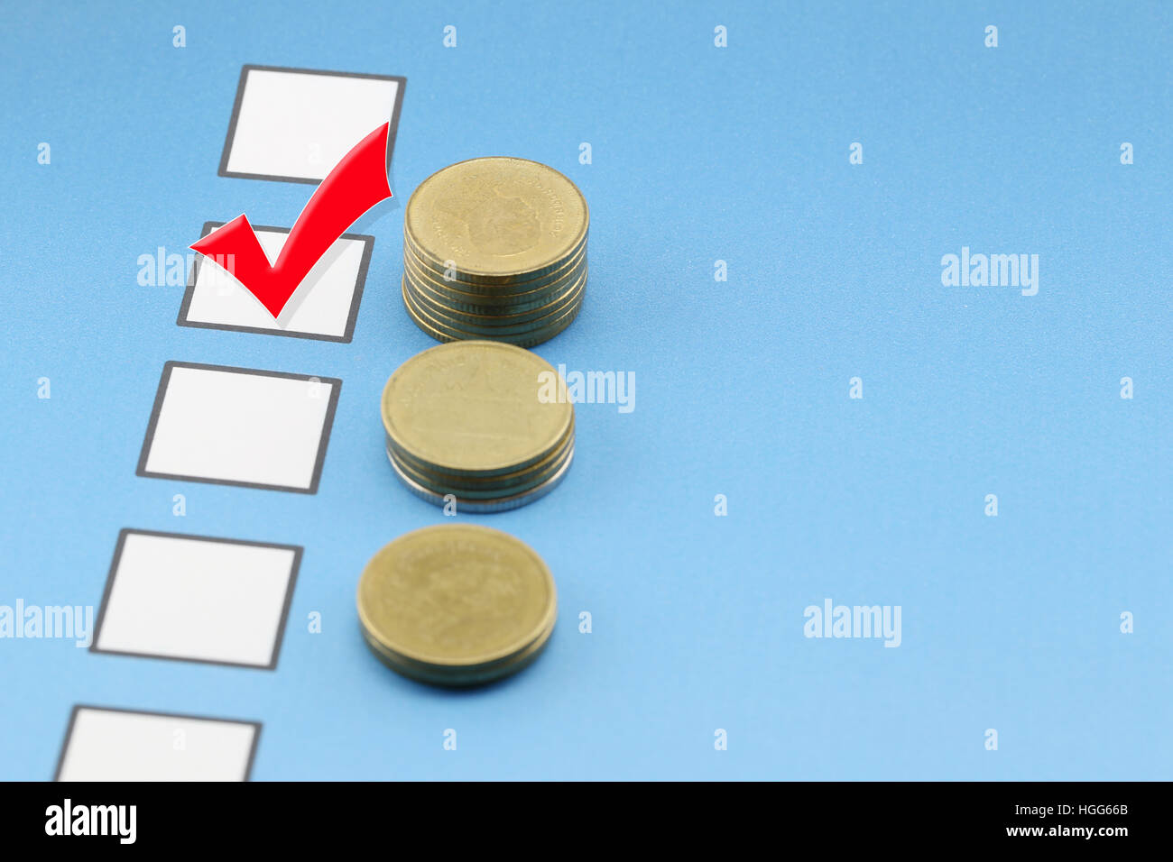 bar graph of Gold coins on blue paper documents and Red check mark on ...