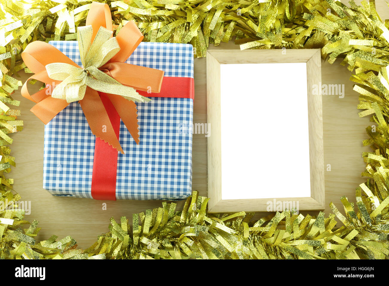 Blue gift box place near wooden frame on the wood floor in concept of ...