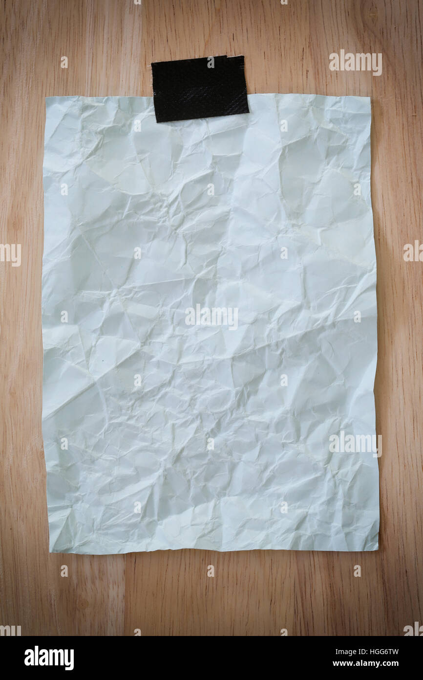 Blue notepad paper crumpled of empty and copy space on wooden ...