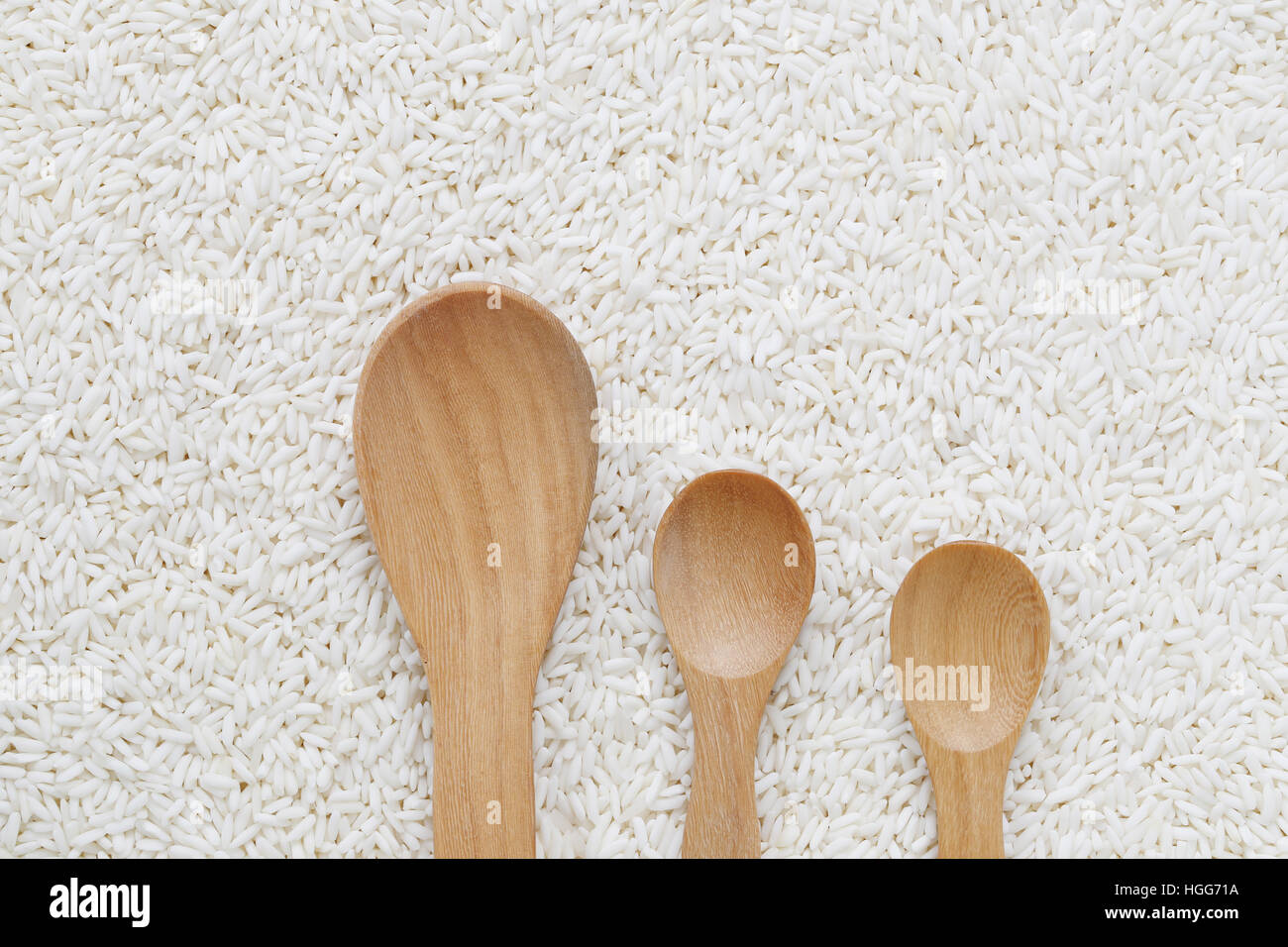 Wooden spoon of empty on organic white rice, glutinous rice or sticky ...