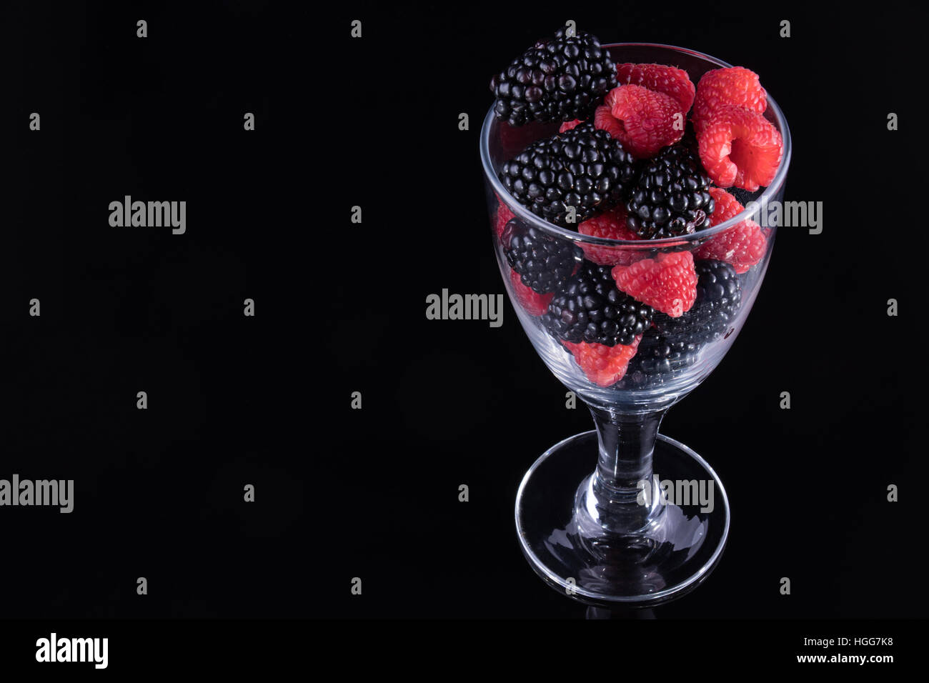 Blackberries and raspberries in a glass Stock Photo - Alamy