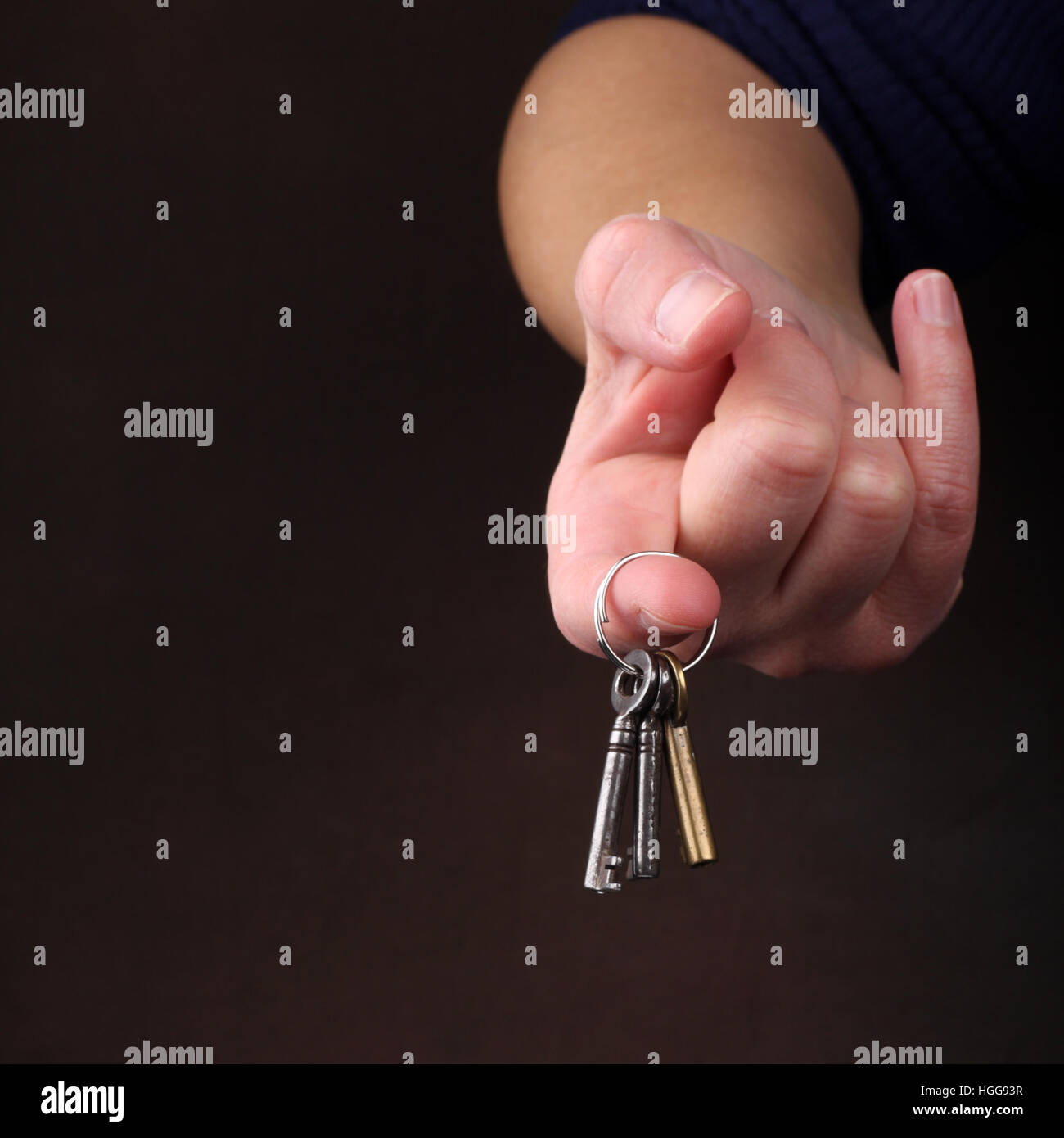 Hands with keys Stock Photo - Alamy