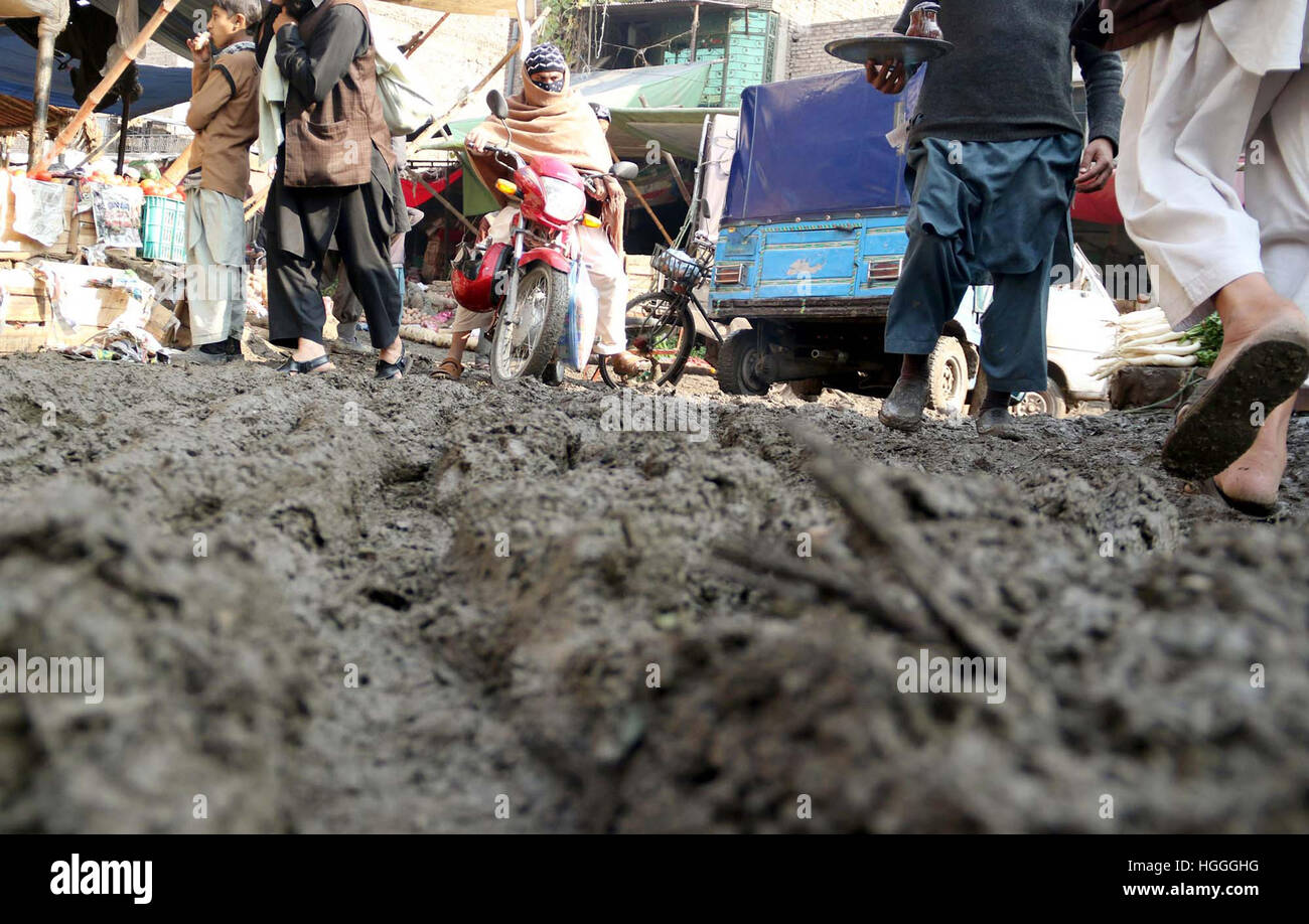 People pass through mud hi-res stock photography and images - Alamy