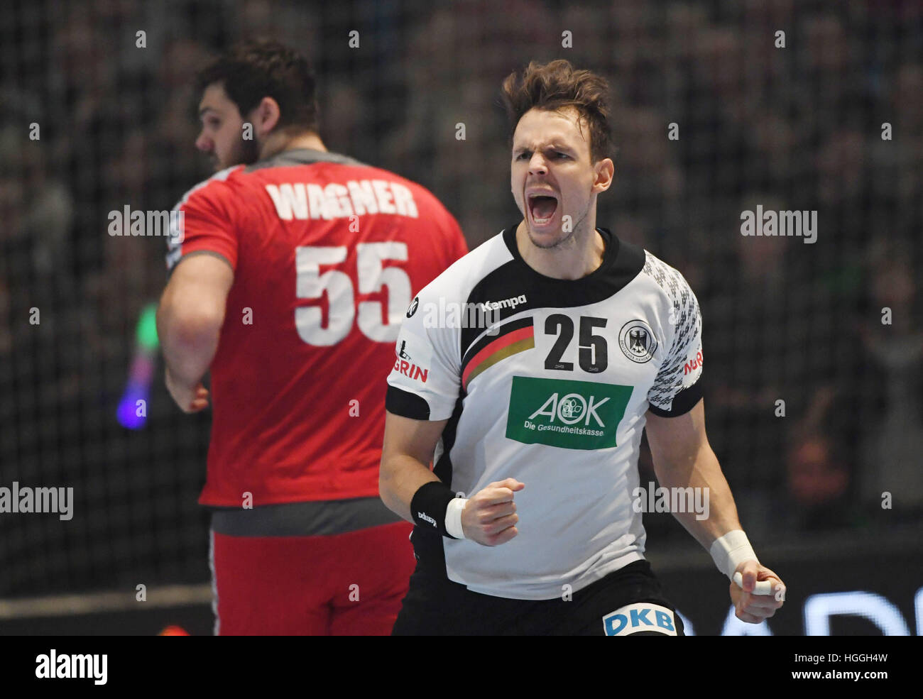 Kassel, Germany. 9th Jan, 2017. Germany's Kai Haefner (r) celebrates ...