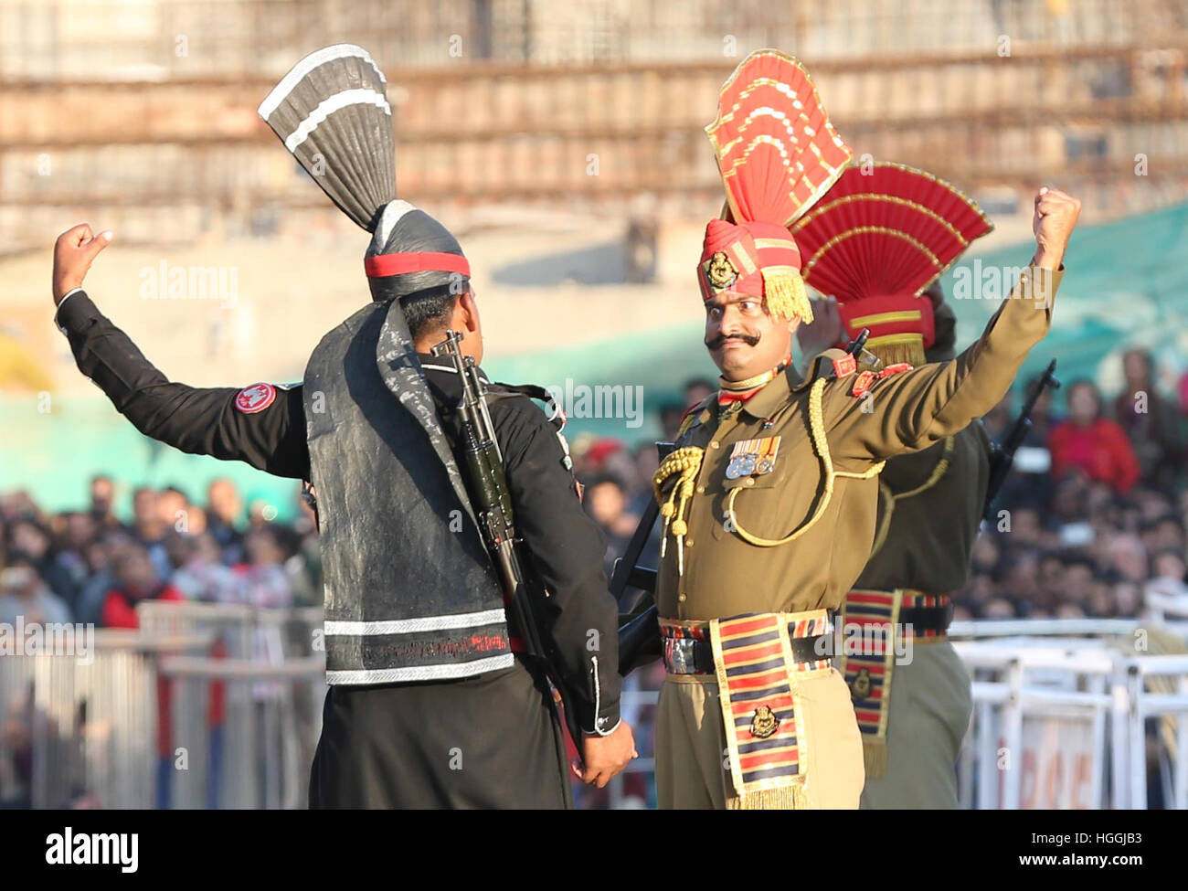 Lahore. 9th Jan, 2017. A Pakistani ranger (L) poses gesture to an ...