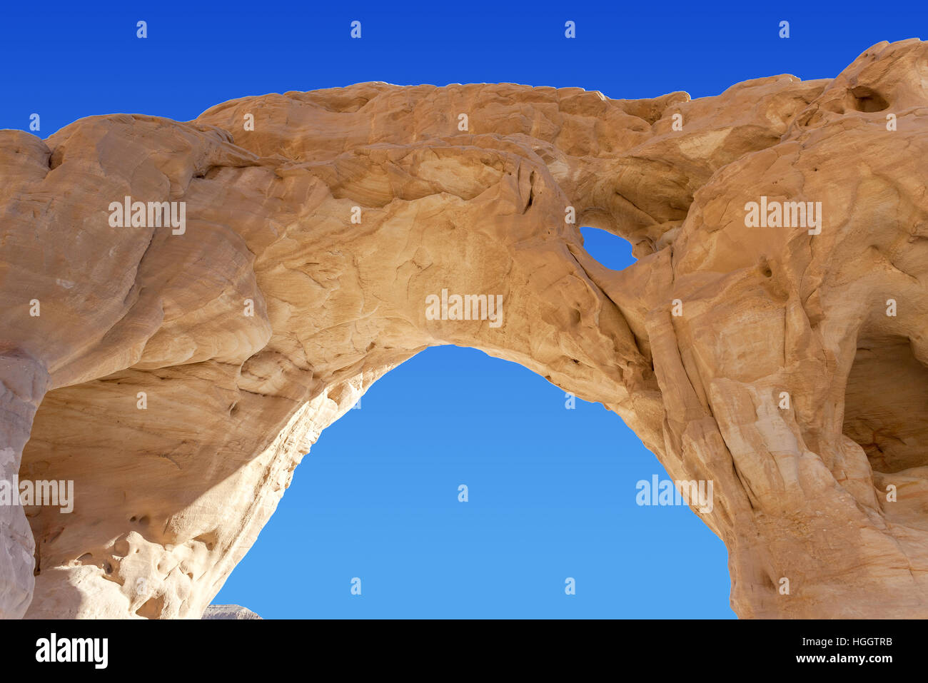 Timna park - The big arch with Desert landscape view Stock Photo - Alamy