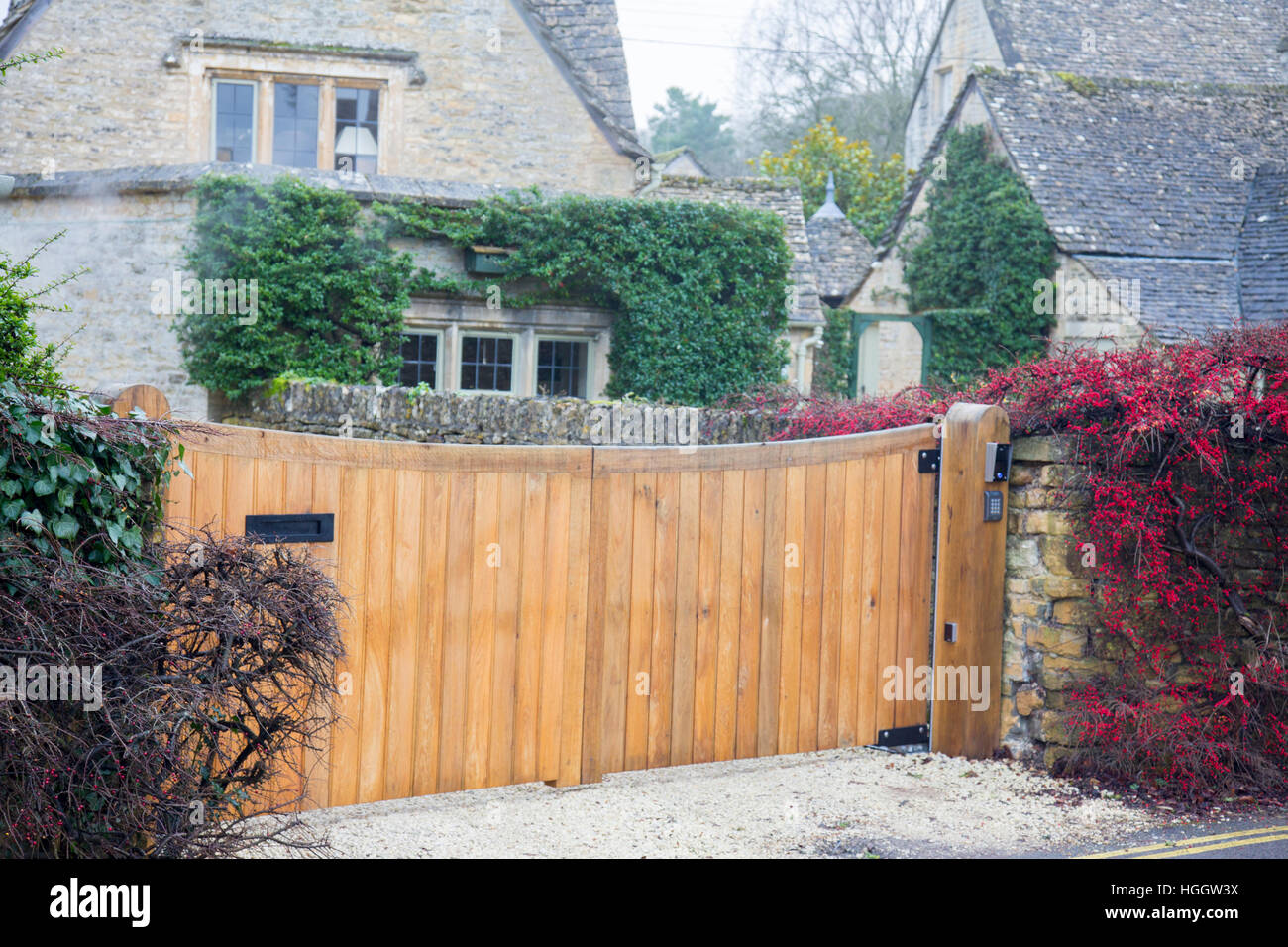 Timber wooden gate at the entrance to a traditional English house in ...