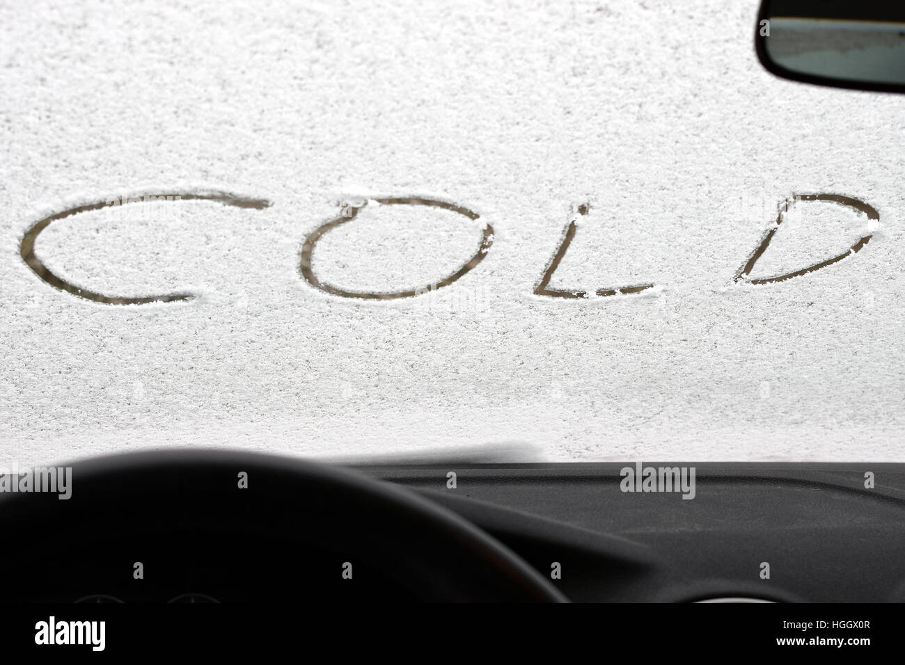 Word cold written to car windshield. View from inside Stock Photo - Alamy