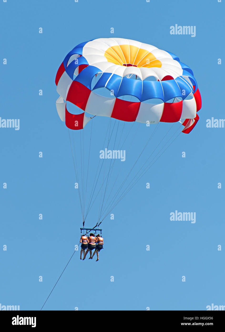 Parasailing. Three women having fun on parachute Stock Photo - Alamy