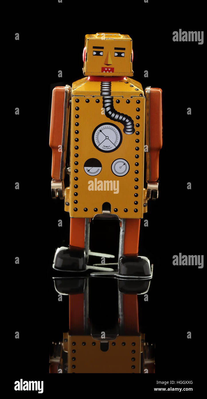 Retro Tin Robot on a Black Background Stock Photo - Alamy