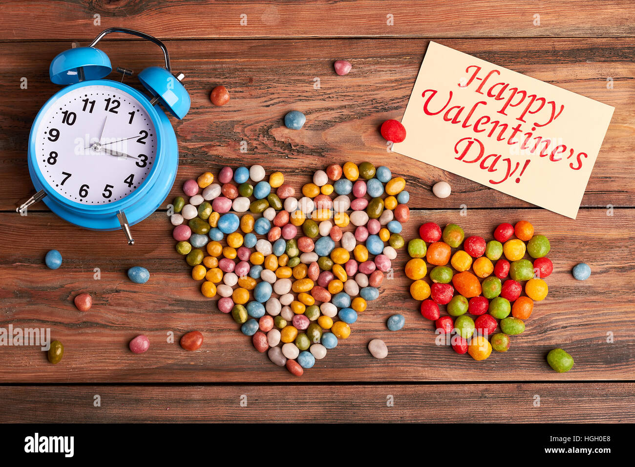 Greeting card and alarm clock Stock Photo - Alamy