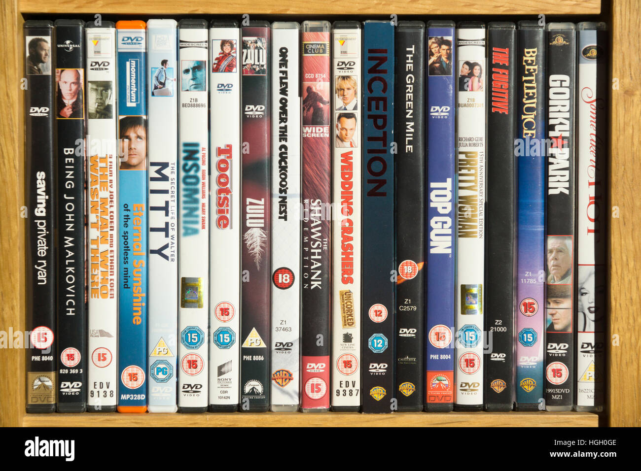 DVDs in a wooden stand Stock Photo - Alamy
