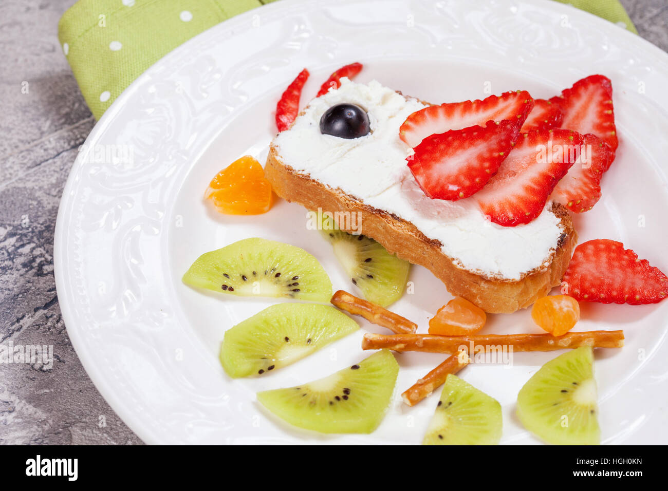 Kid's breakfast toast with fruit and cream cheese Stock Photo - Alamy