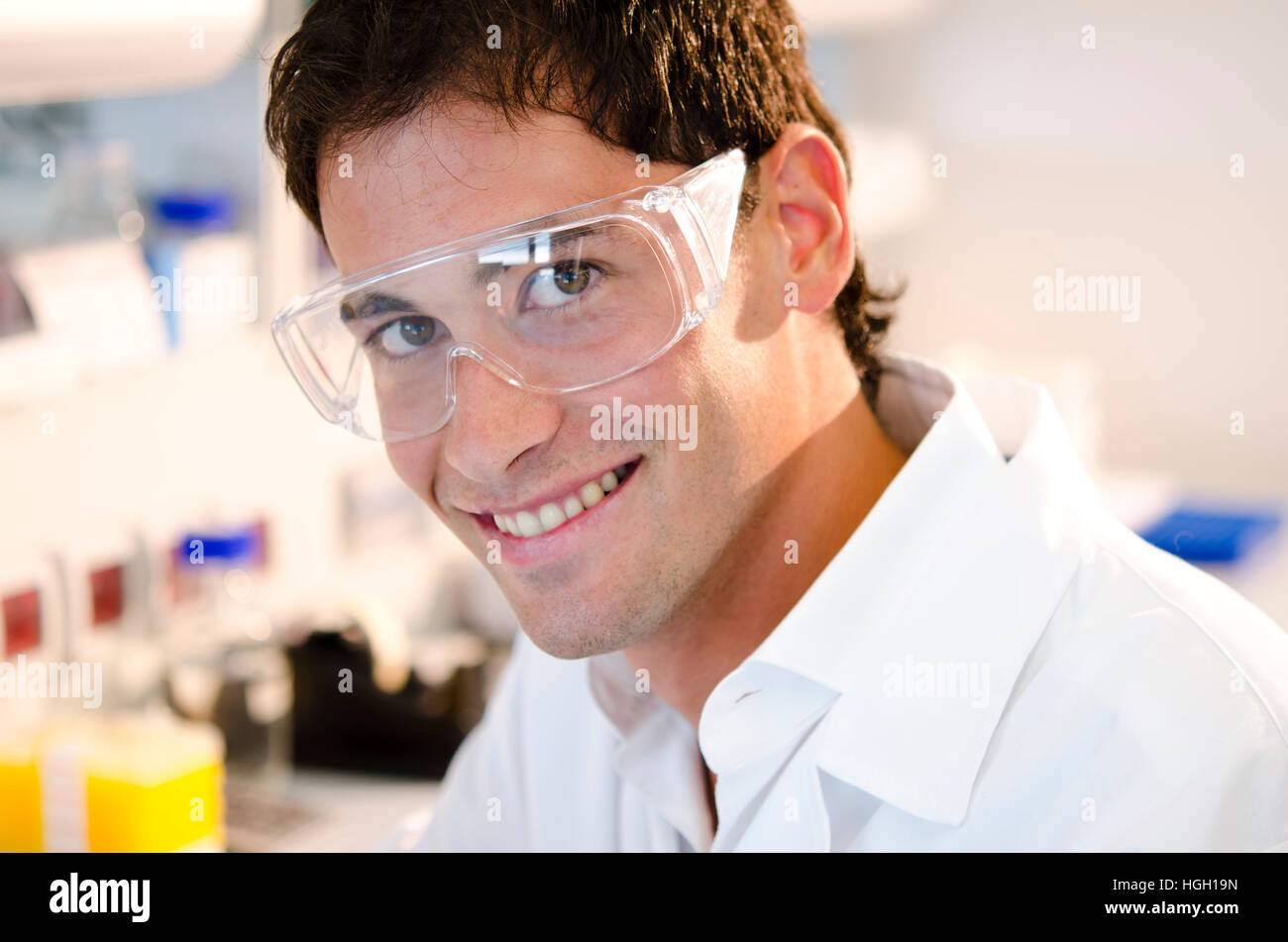 Portrait of a smiling young researcher inside his laboratory Stock ...