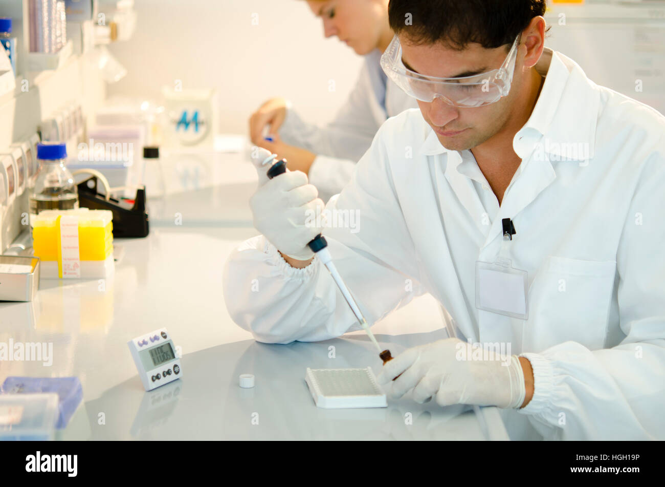 Two young researchers at work Stock Photo - Alamy