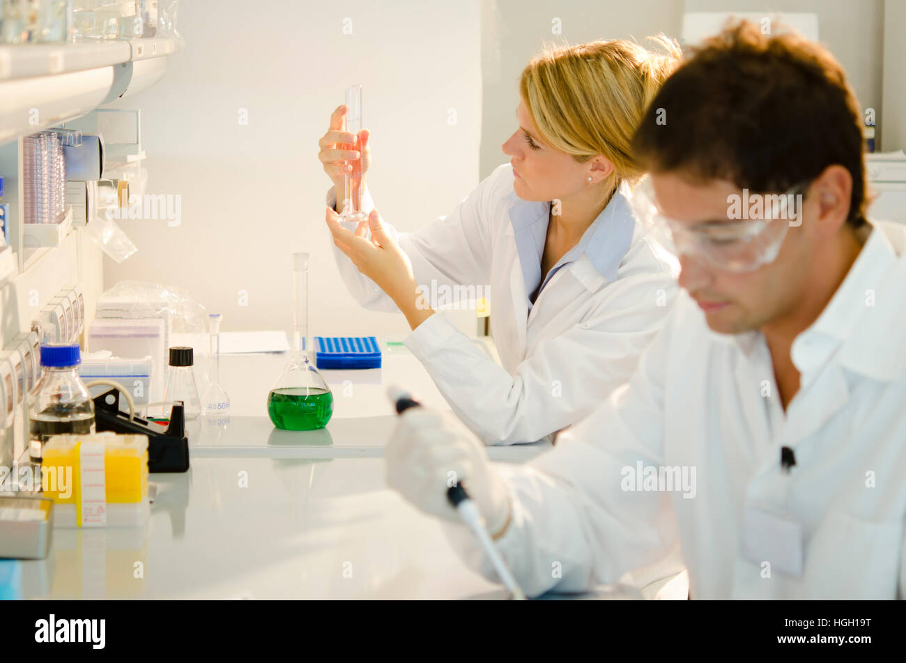 Two young researchers at work Stock Photo - Alamy