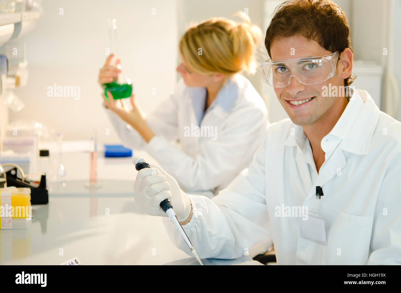 Two young researchers at work Stock Photo - Alamy