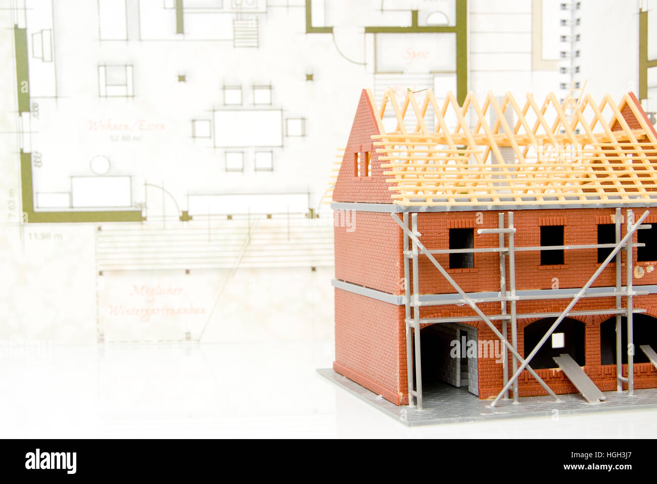 Bare brickwork model with construction plan Stock Photo - Alamy