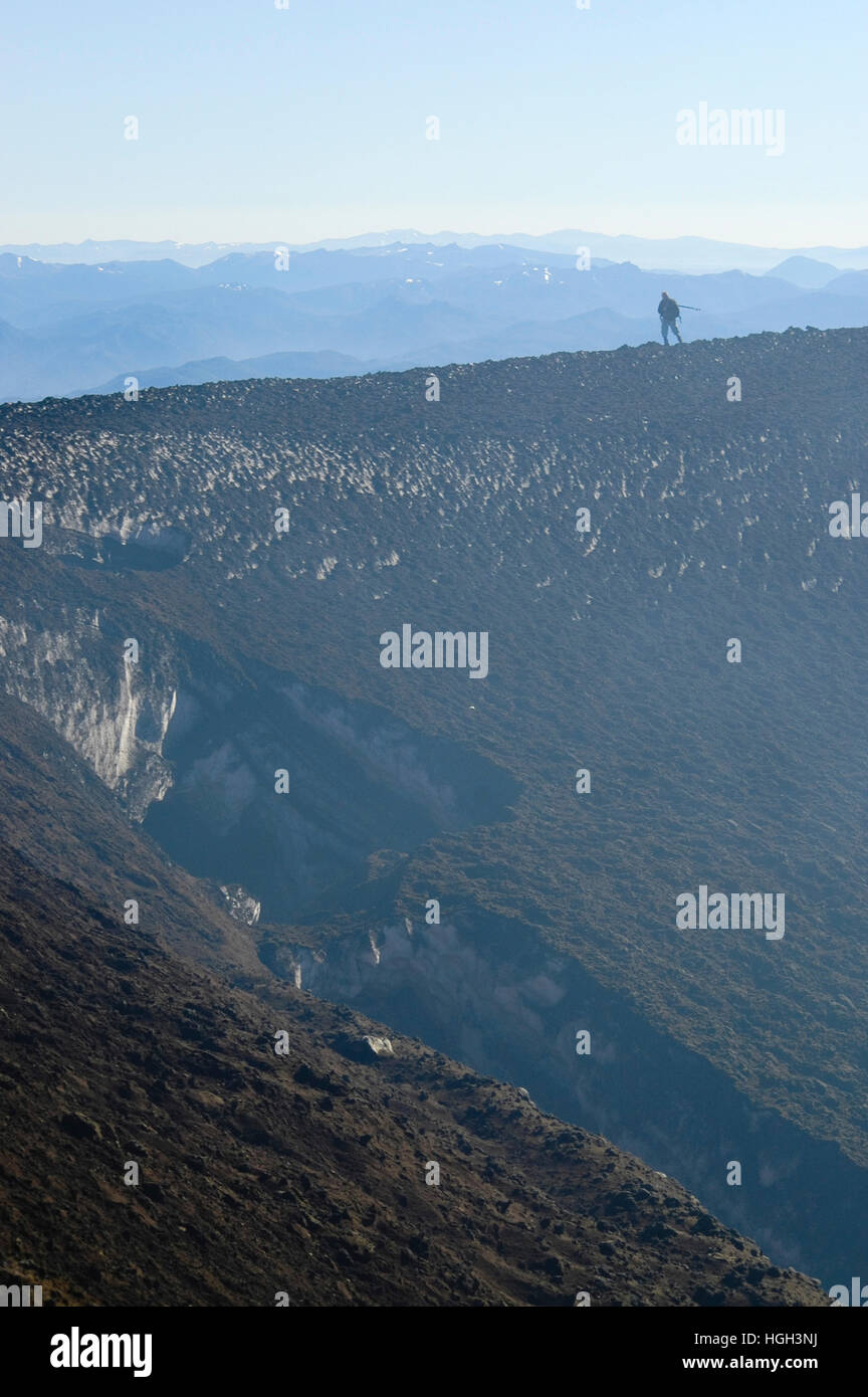 Hiker on the crater rim of Volcano Villarrica, Pucon, Patagonia, Chile ...