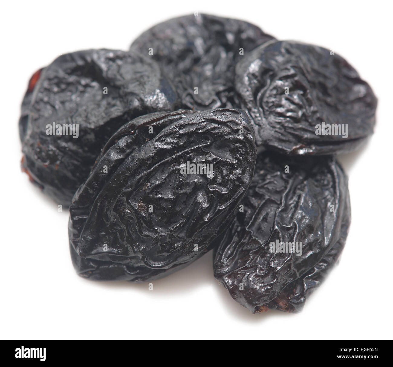 prunes isolated on a white background Stock Photo - Alamy
