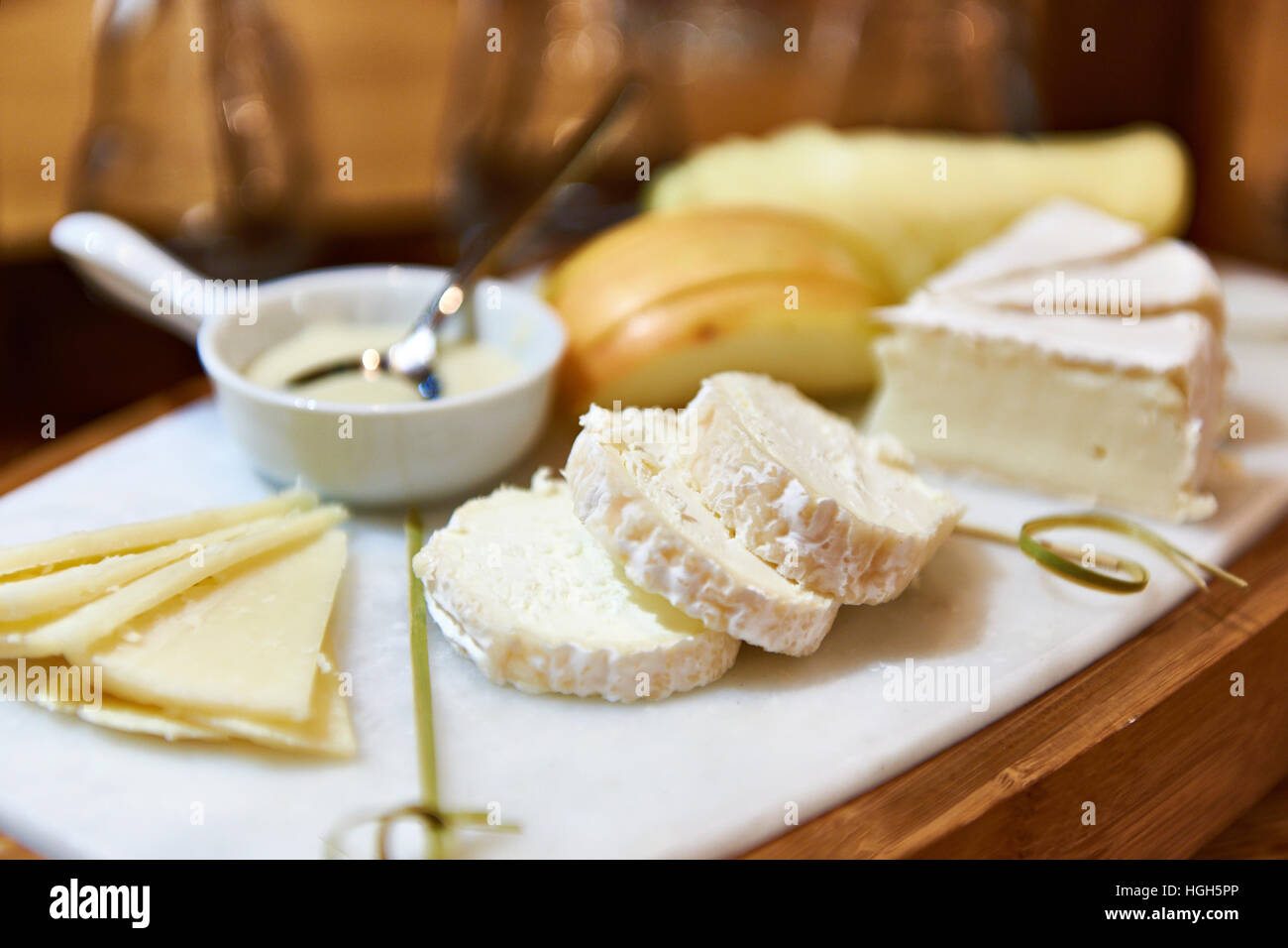 Soft cheese Buche on the cheese plate at the dinner table Stock Photo ...