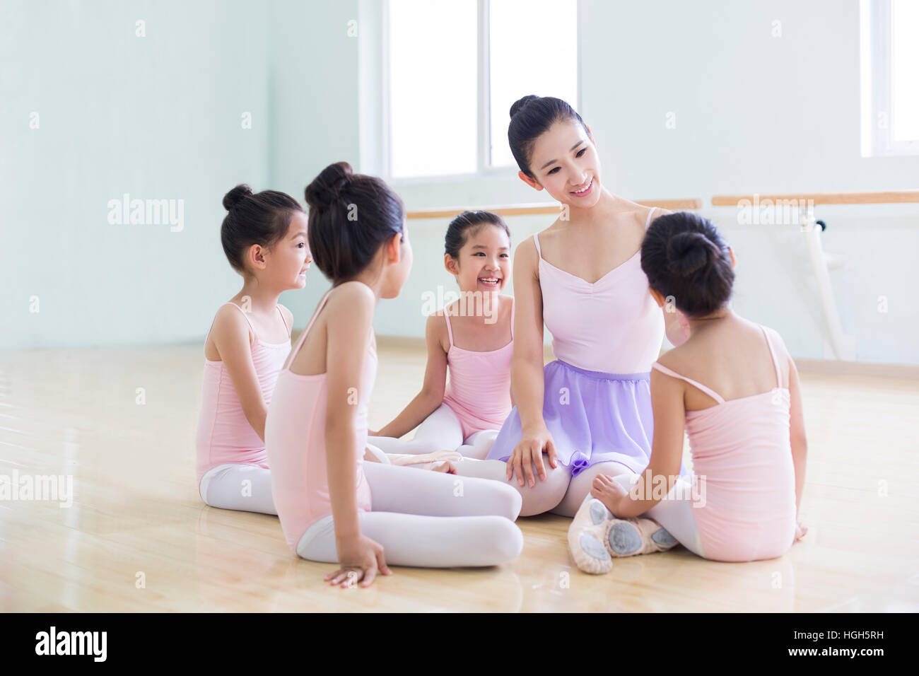 Young ballet instructor teaching girls in ballet studio Stock Photo - Alamy