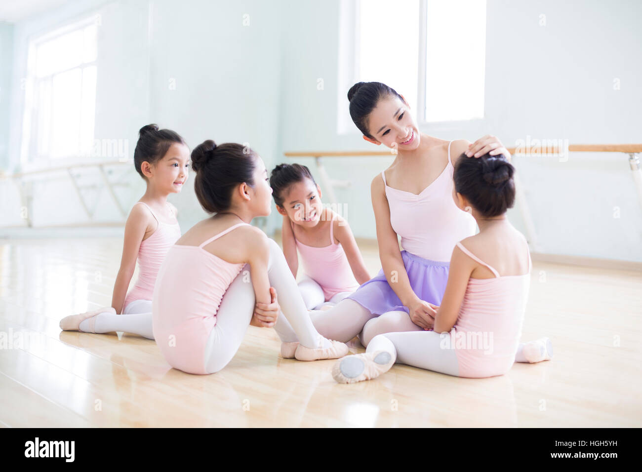 Young ballet instructor teaching girls in ballet studio Stock Photo - Alamy