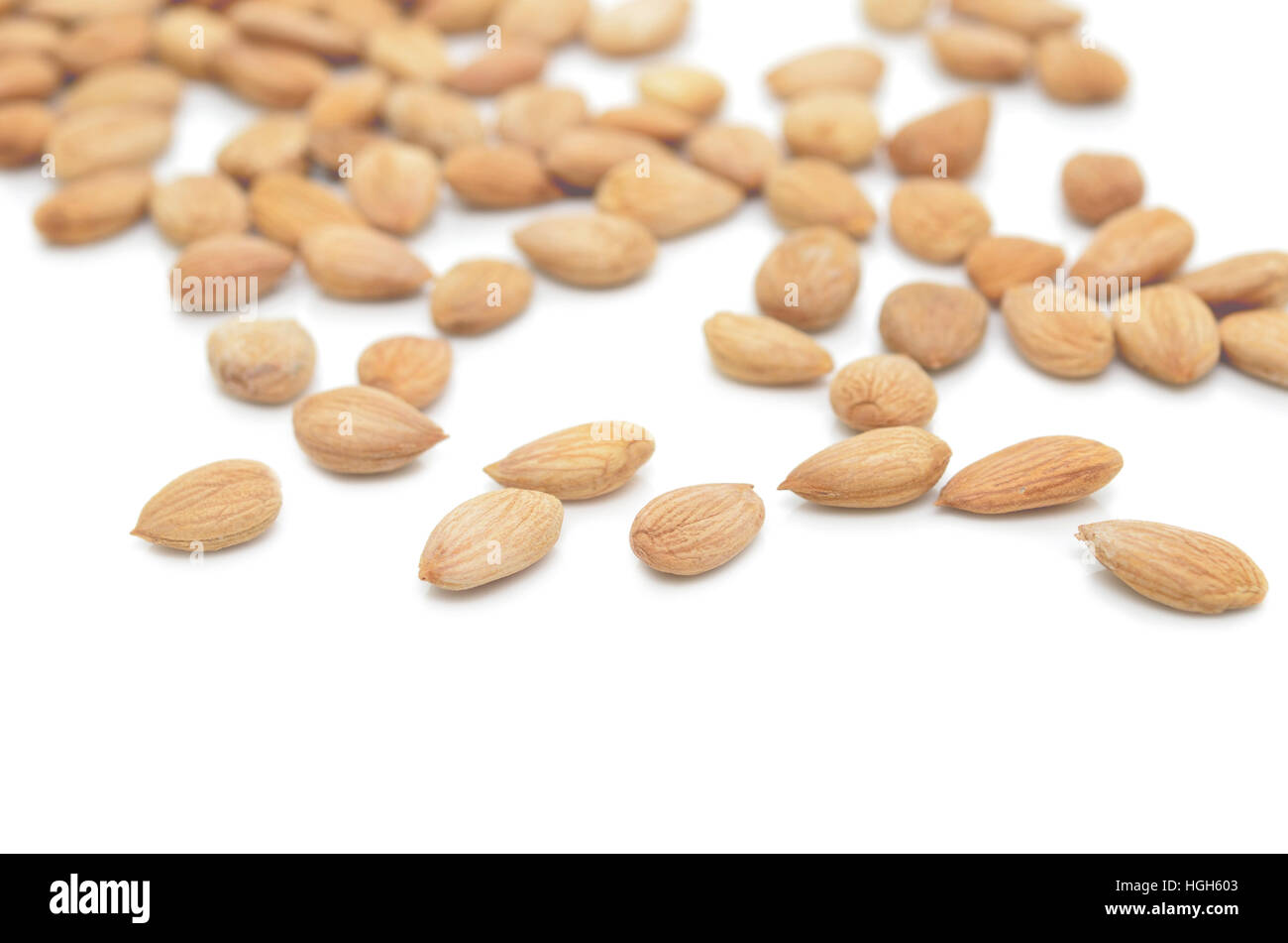apricot almonds isolated on white background Stock Photo - Alamy