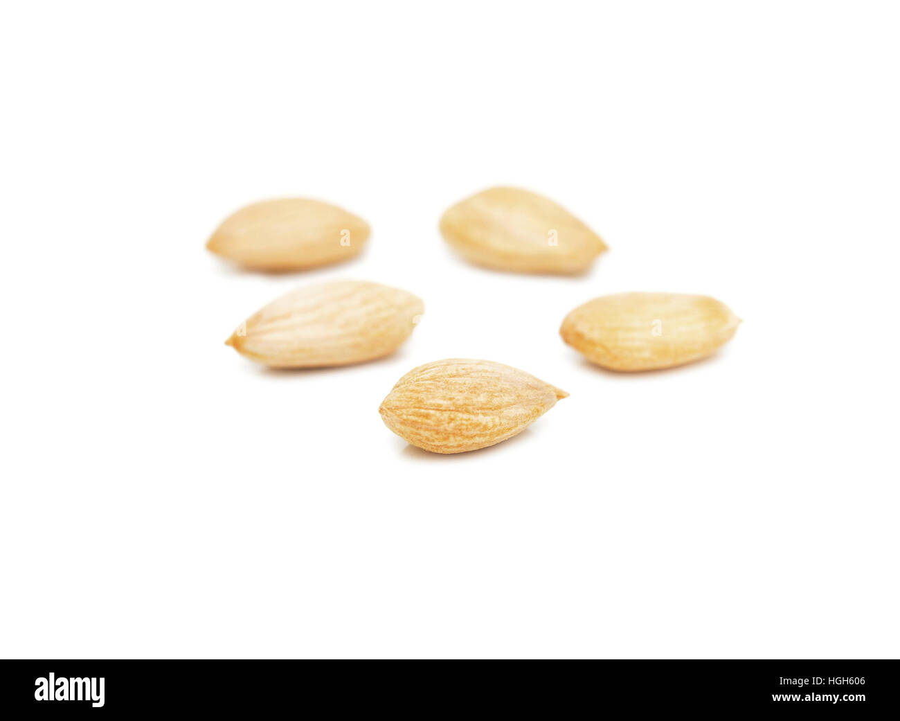 apricot almonds isolated on white background Stock Photo - Alamy