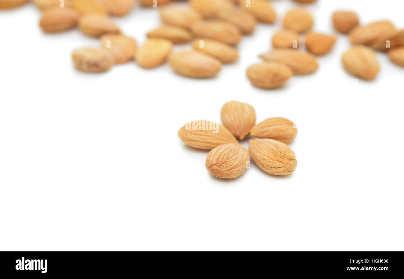 apricot almonds isolated on white background Stock Photo - Alamy
