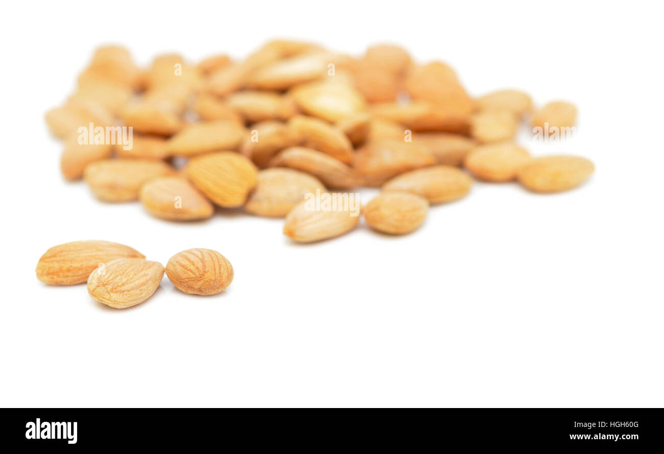 apricot almonds isolated on white background Stock Photo - Alamy