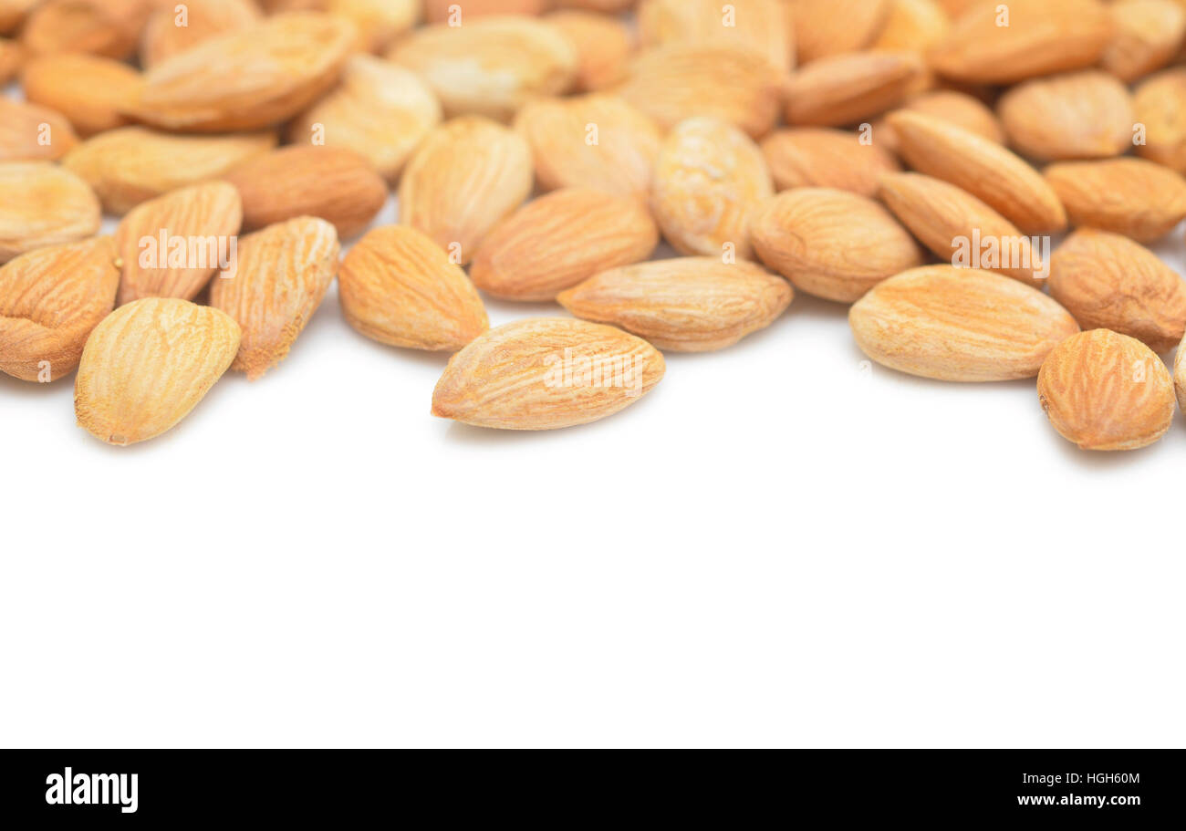 apricot almonds isolated on white background Stock Photo - Alamy