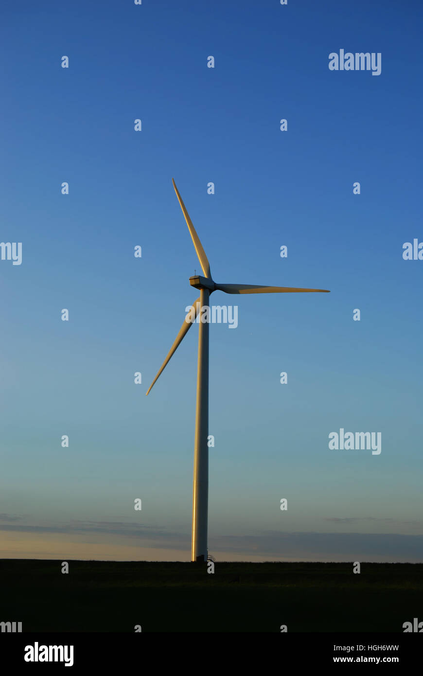 A wind turbine generates renewable energy on the plains of Iowa Stock ...
