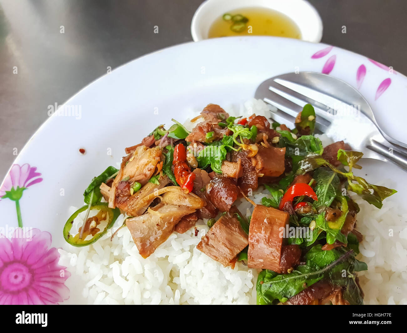 Close-up,Thai food style:Pad Kra Pao Kha Moo, spicy stir-fried pork leg ...