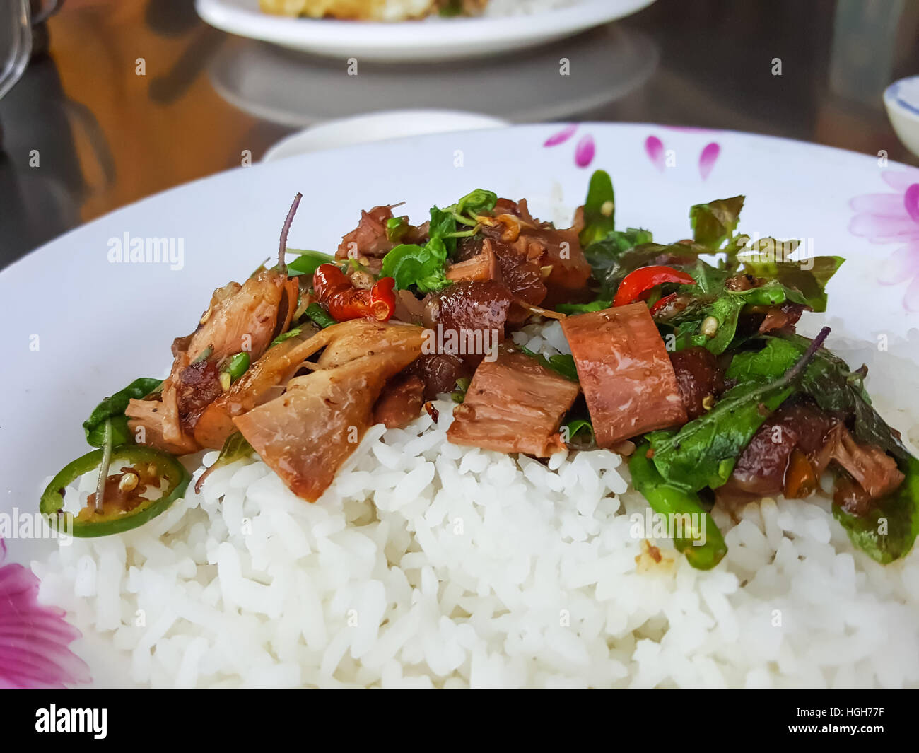 Close-up,Thai food style:Pad Kra Pao Kha Moo, spicy stir-fried pork leg ...