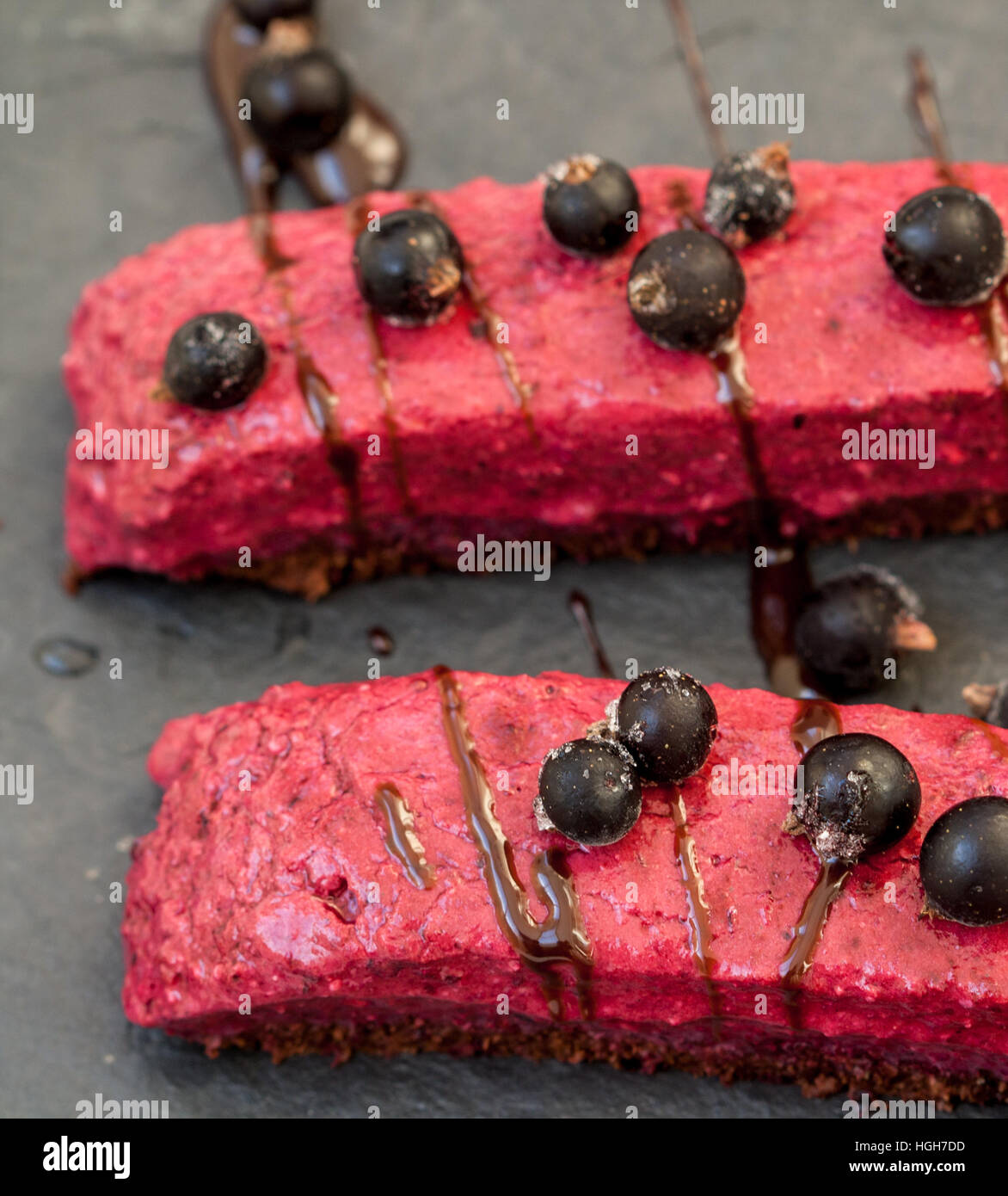Raw chocolate berry cake with berries and chocolate syrup and currant ...
