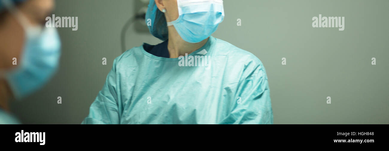 Surgeon in hospital surgery in sterile uniform "scrubs" in operating ...