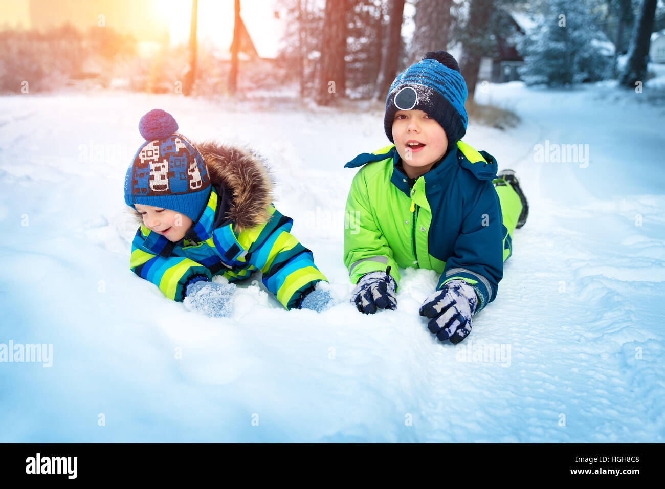 Children playing in snow at snowfall Stock Photo - Alamy