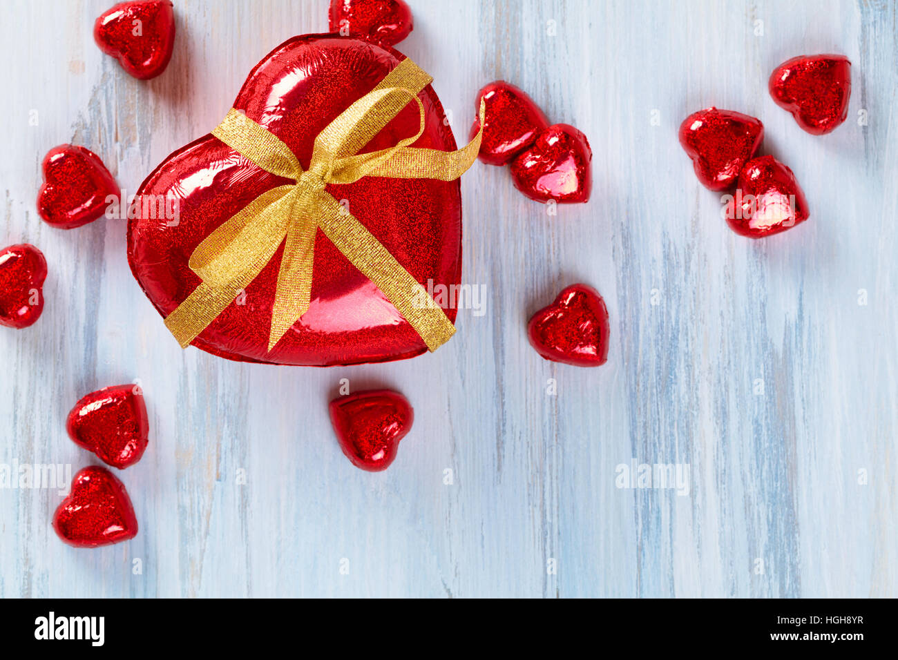 Red roses and heart shaped chocolate candies Stock Photo - Alamy