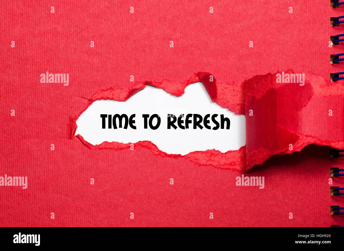 The word time to refresh appearing behind torn paper Stock Photo - Alamy