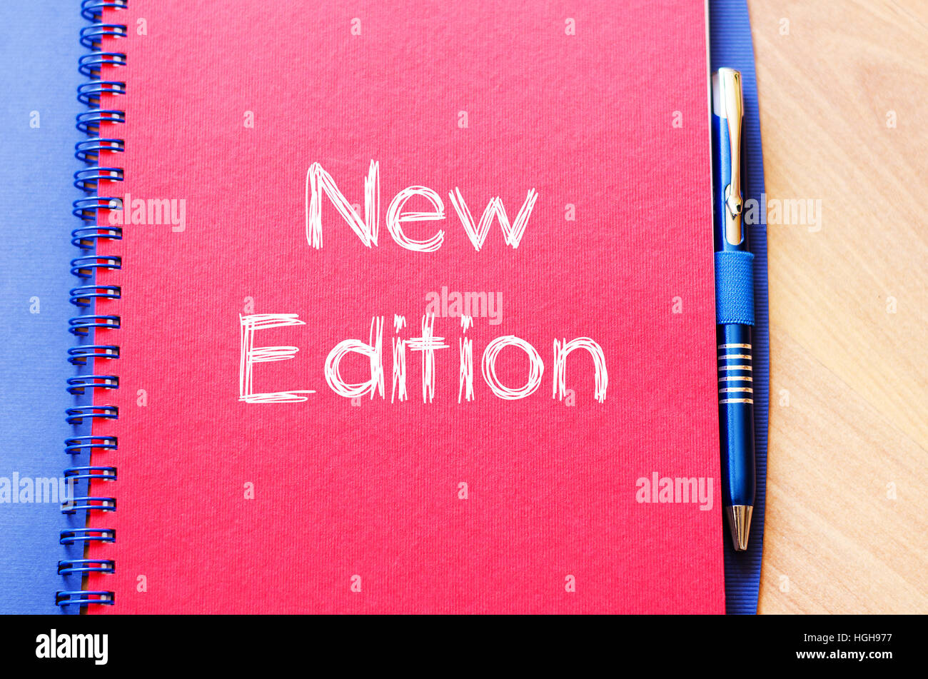 New edition text concept write on notebook Stock Photo - Alamy