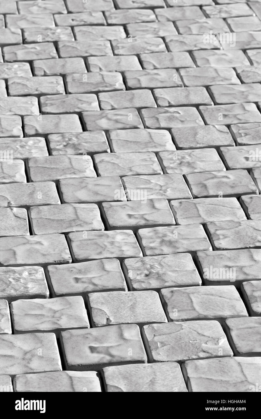 Modern cobblestone paved road close-up Stock Photo - Alamy