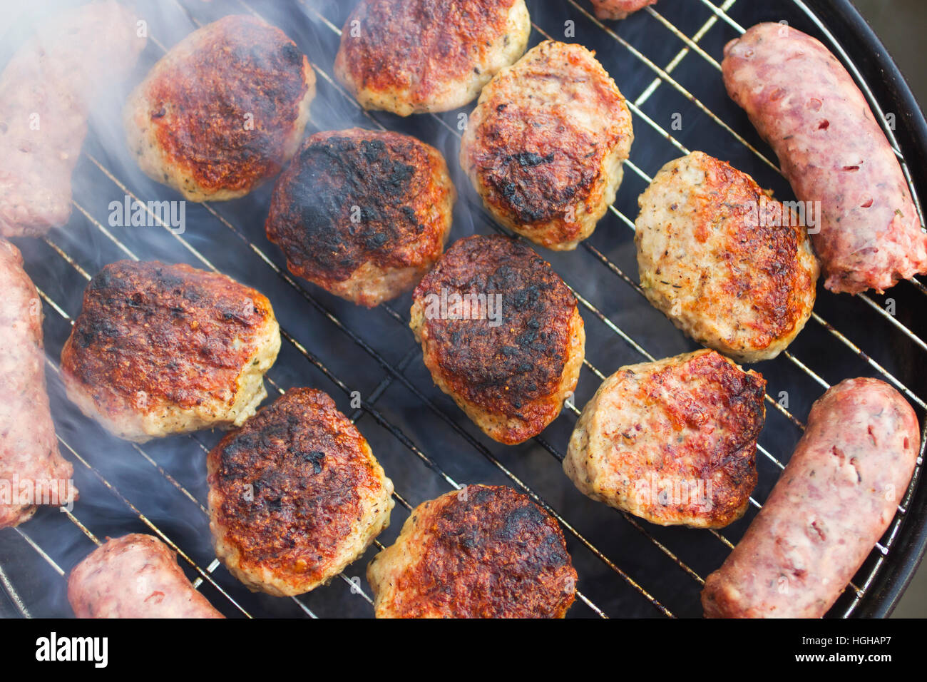 Grilled meat on barbecue Stock Photo - Alamy