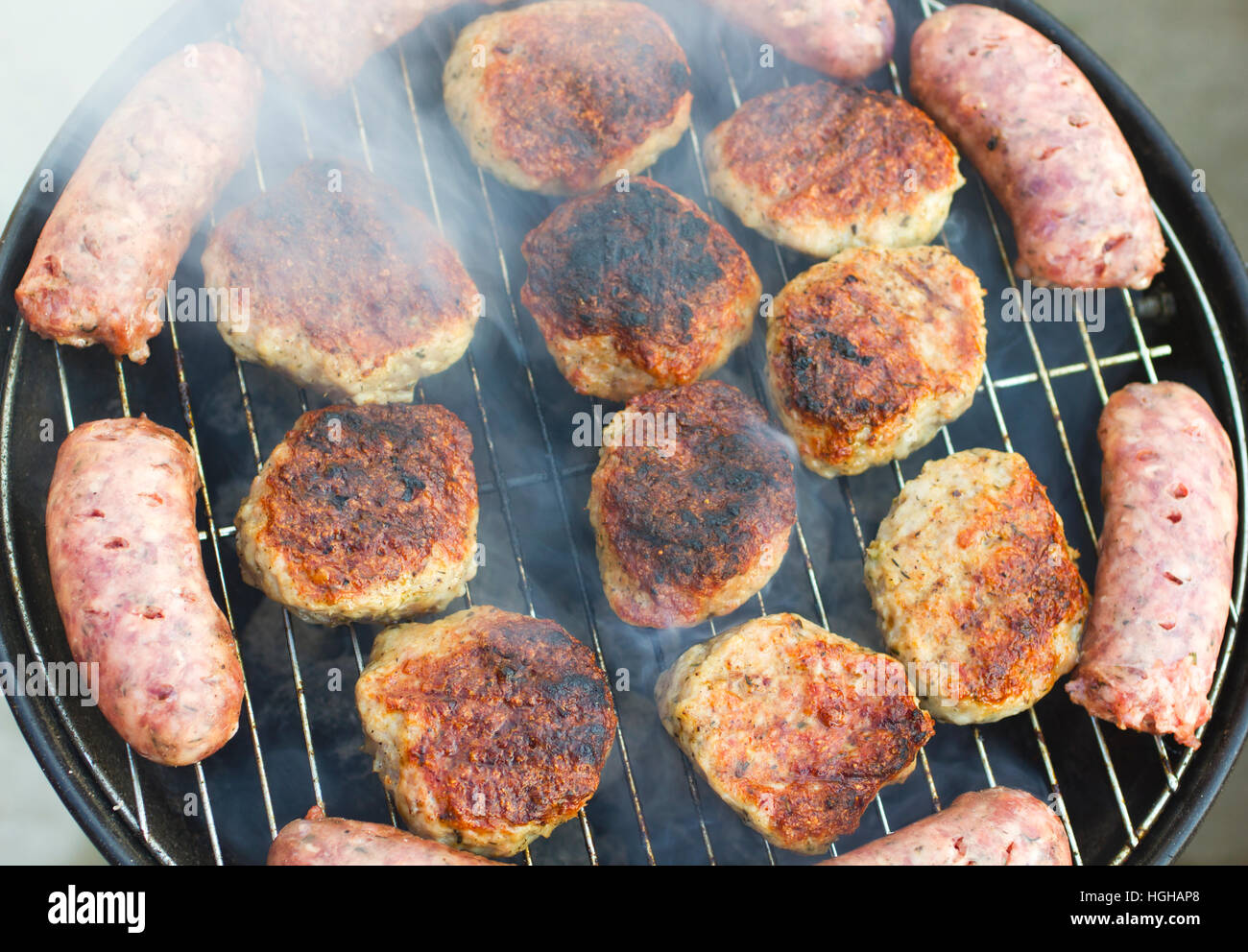 Grilled meat on barbecue Stock Photo - Alamy