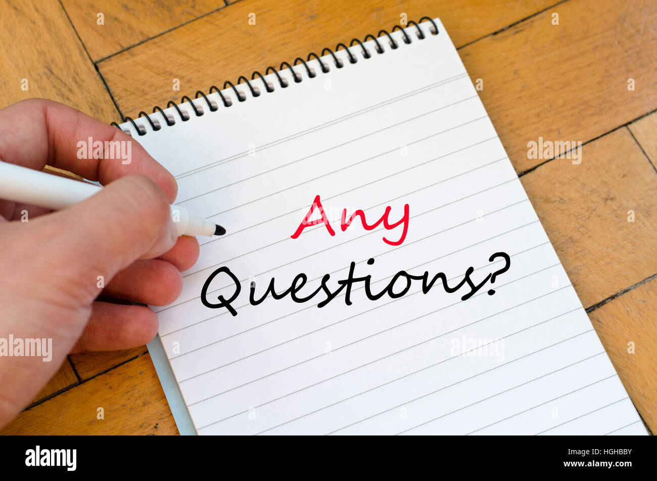 Human hand over wooden background and any questions text concept Stock ...