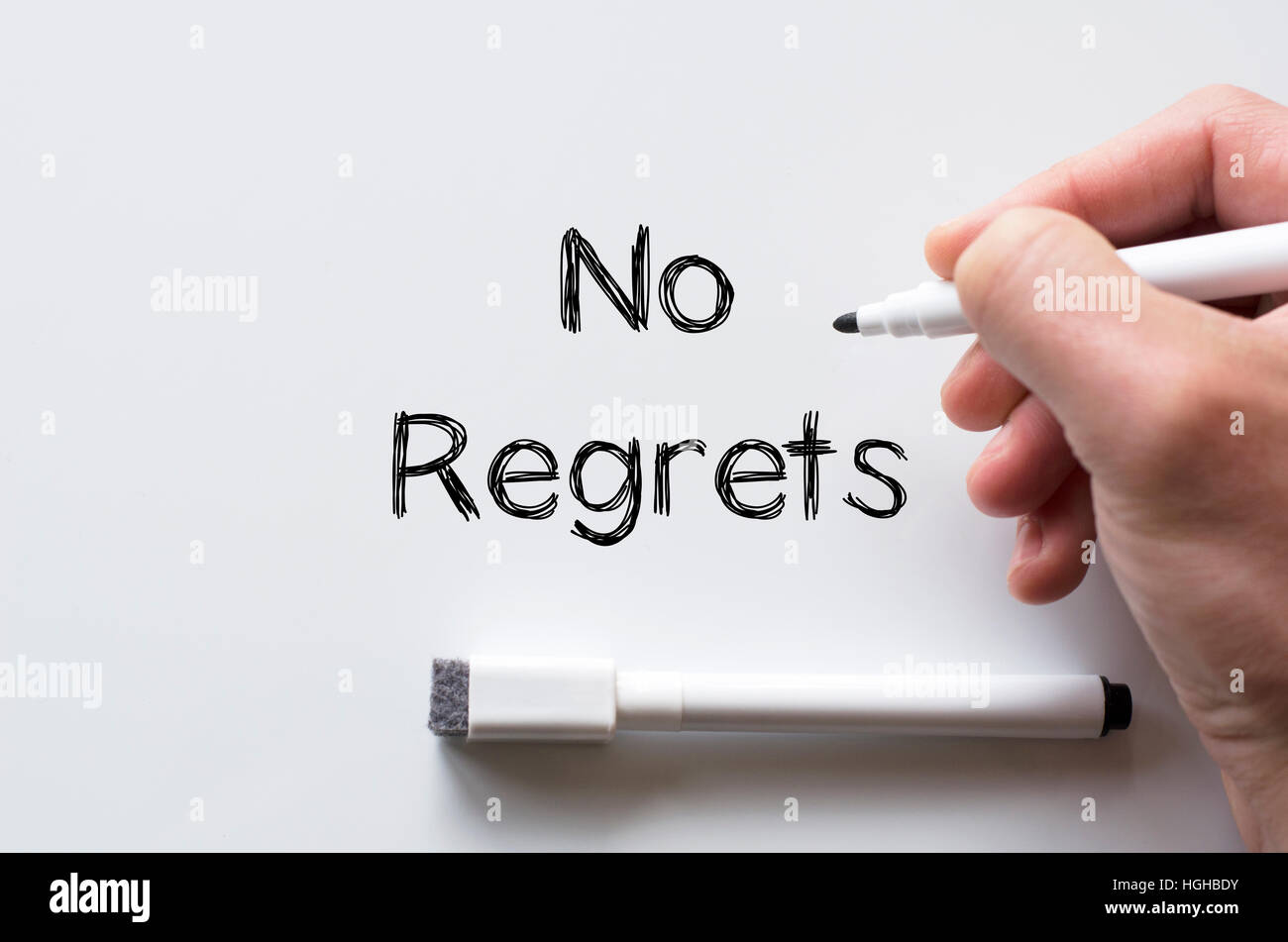 Human hand writing no regrets on whiteboard Stock Photo - Alamy