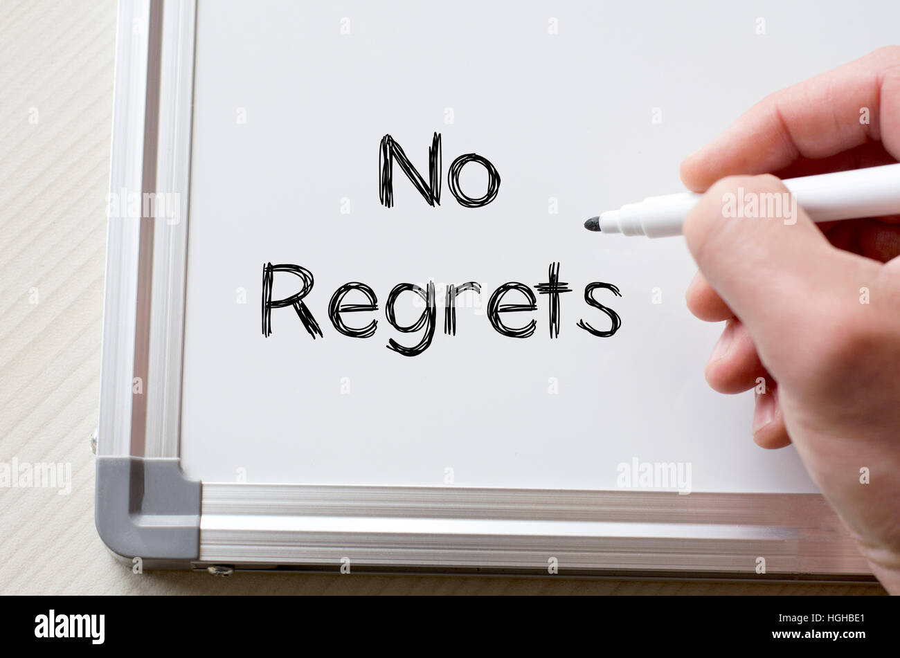 Human hand writing no regrets on whiteboard Stock Photo - Alamy